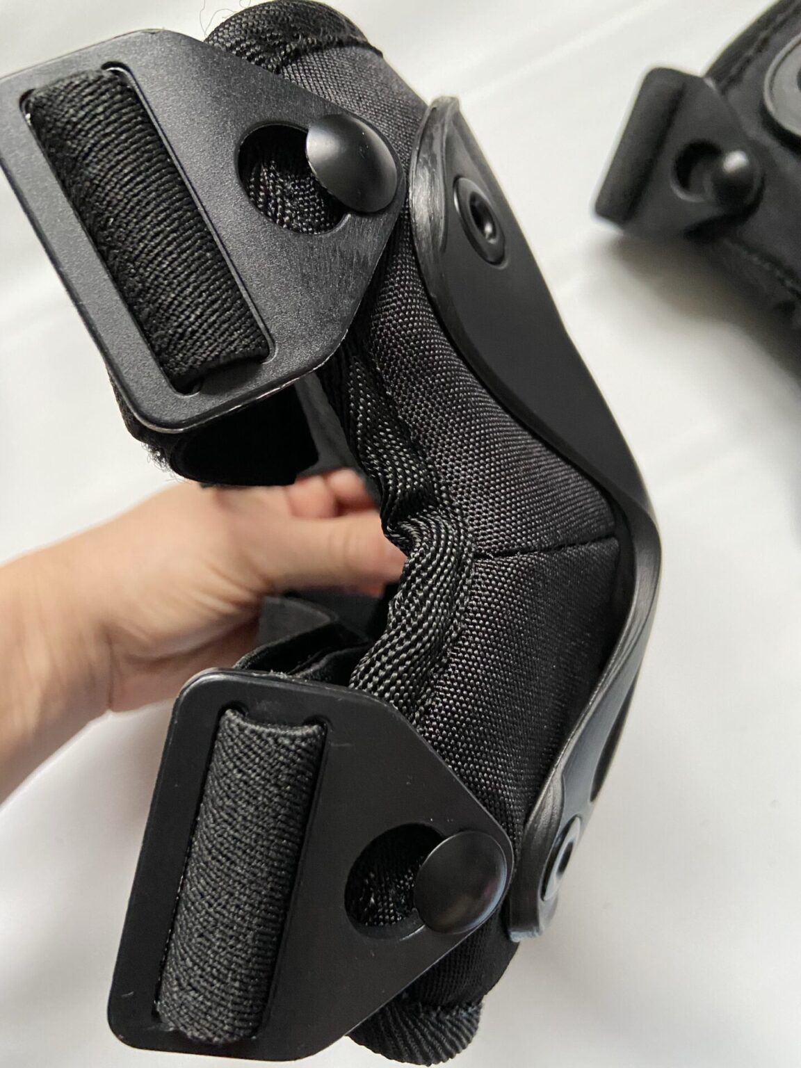 Angled black knee pads – Bondatrix